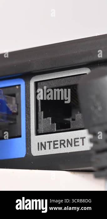 The internet cable is plugged into the router Stock Video Footage - Alamy