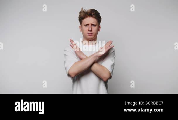 A young man displays various expressions of disagreement through body ...