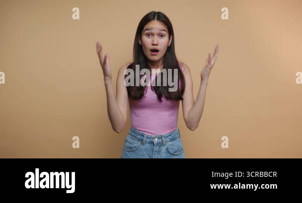 A woman shares her excitement while using lively hand movements and ...