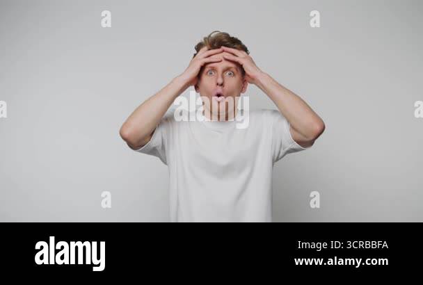 A man displays a range of emotions, showing surprise and disbelief in ...