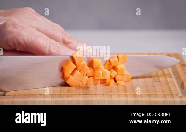 chef cut carrot on cutting board with sharp knife for making healthy ...