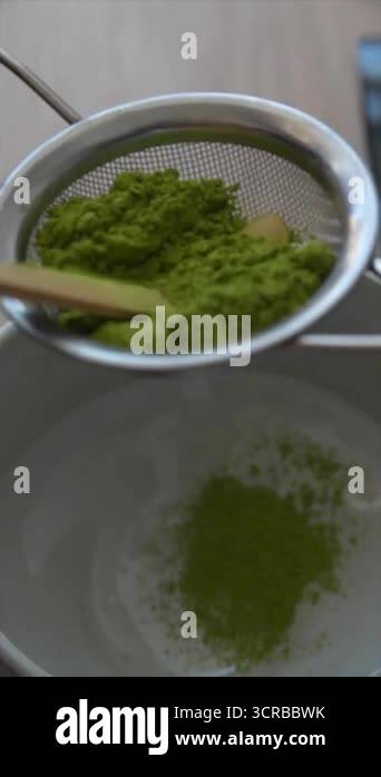 Master the intricate art of matcha preparation by carefully sifting ...