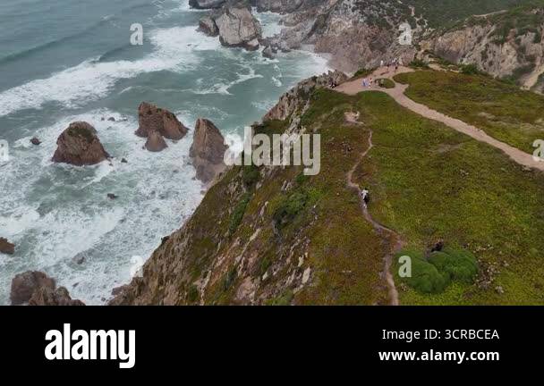 Experience a breathtaking aerial perspective of the rugged coastal ...
