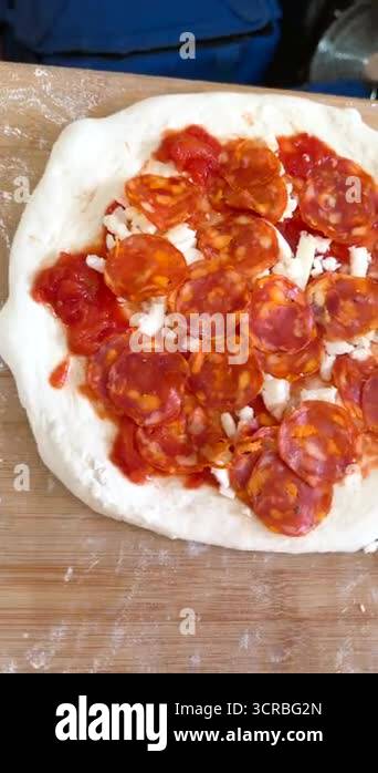 Capturing the art of making delicious pepperoni pizza from its ...