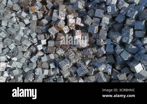 Piles of small metallic cubes or scrap pieces. Steel Billets, Iron ...