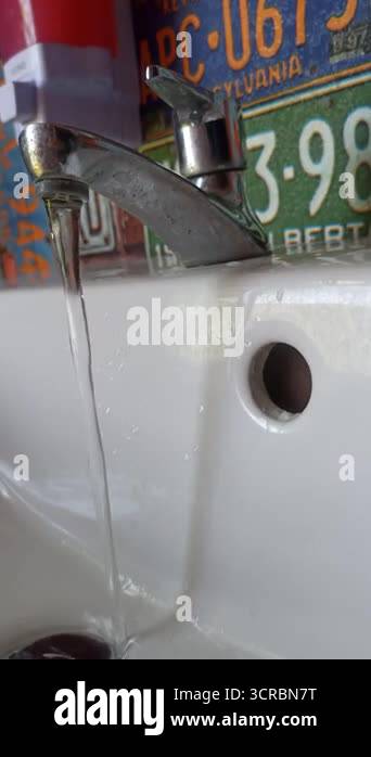 Water faucet at a restaurant sink, clean and functional, used for ...