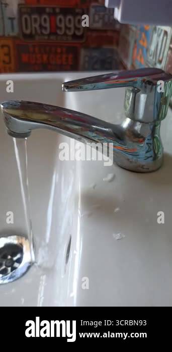 Water faucet at a restaurant sink, clean and functional, used for ...