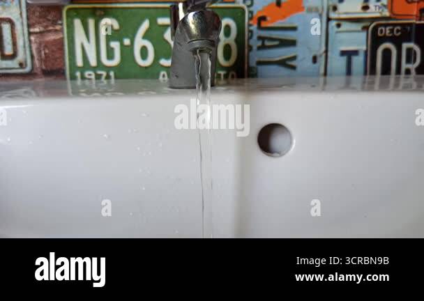 Water faucet at a restaurant sink, clean and functional, used for ...