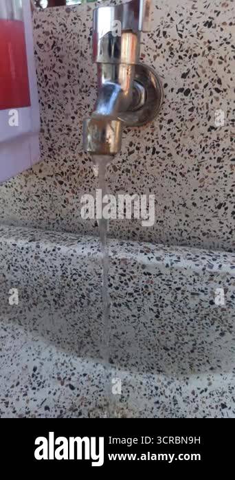 Water faucet at a restaurant sink, clean and functional, used for ...