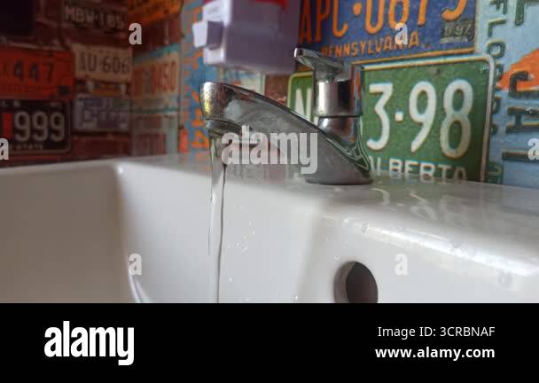 Water faucet at a restaurant sink, clean and functional, used for ...
