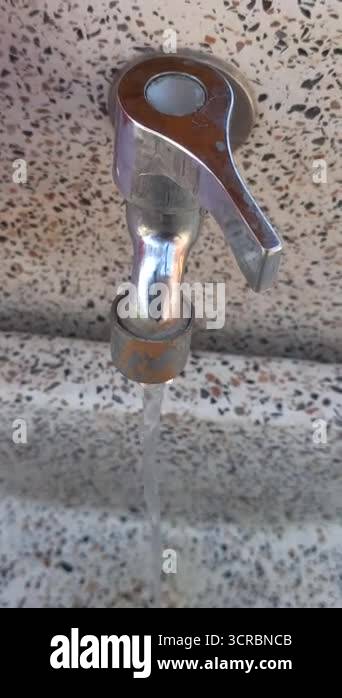 Water faucet at a restaurant sink, clean and functional, used for ...