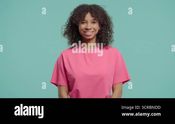 Gorgeous african american teenager showing yes signal, nods head ...