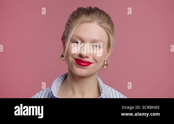 Gorgeous american woman with red lips showing yes signal, nods head ...