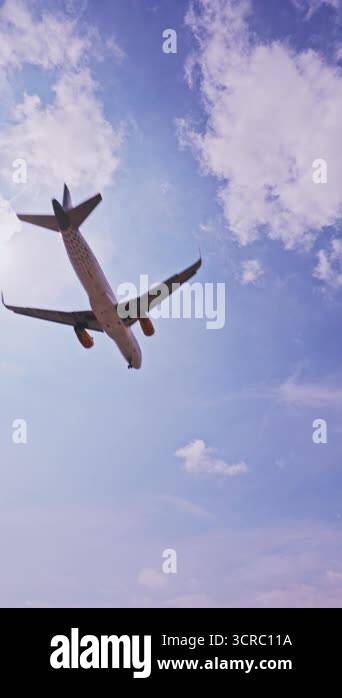 Airplane flying close overhead coming in to land in barcelona airport ...