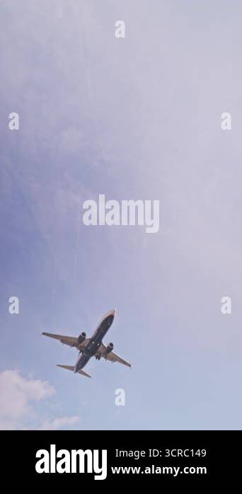 Airplane flying close overhead coming in to land in barcelona airport ...