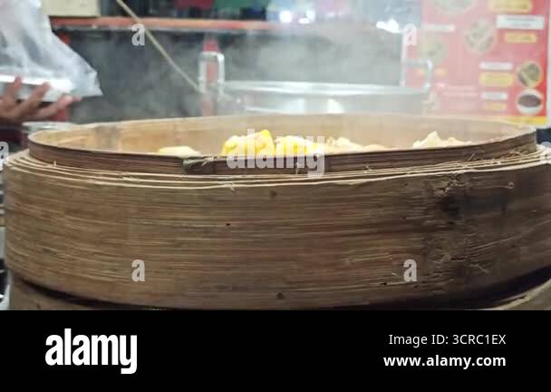 Traditional dim sum served in bamboo steamer, freshly steamed ...