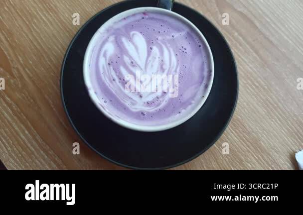 A cup of hot taro drink ready to be enjoyed, warm and sweet with creamy ...