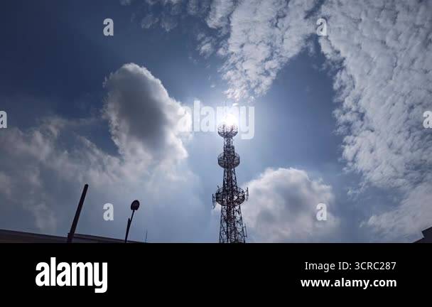 Signal tower standing tall under the blazing midday sun, showing strong ...