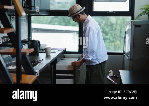 Professional chef using smartphone and preparing ingredients in modern ...