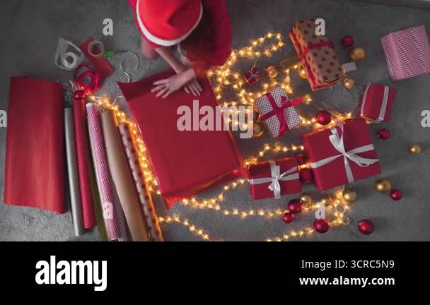 A joyful scene that captures gift wrapping art. Colorful papers ...