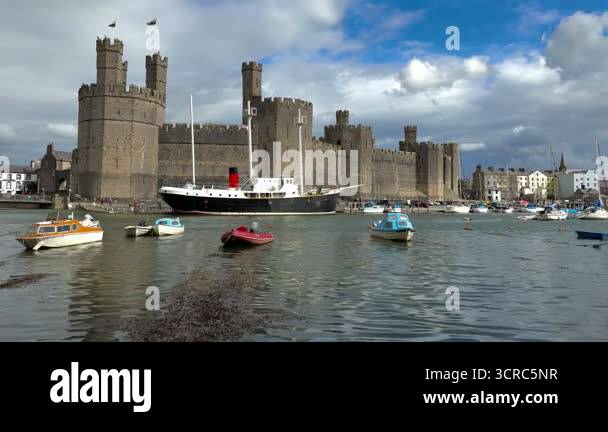 Caernarfon Castle on the north Wales coast. A medieval fortress that ...