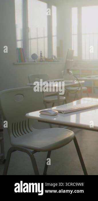 Modern Computer Classroom with White Desks and Computer Monitors for ...
