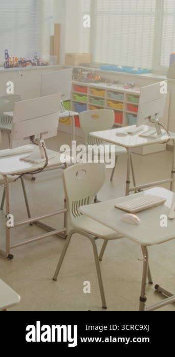 Modern Computer Classroom with White Desks and Computer Monitors for ...