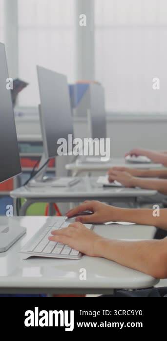 Primary School Students Drawing Pictures on Computers, Working on ...
