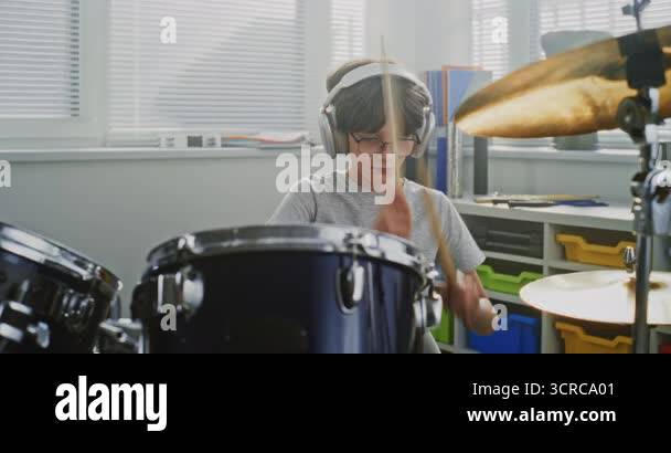 Talented Boy Wearing Headphones Playing Drums in Percussion Class of ...