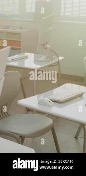 High-Tech School Computer Lab with Minimalist Furniture and PC Monitors ...