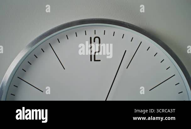 Close Up Shot of Minimalist Wall Clock Hanging on the Wall in Apartment ...