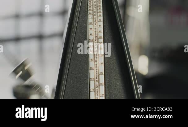 Close Up of Classic Wooden Metronome with Swinging Pendulum, Helping ...