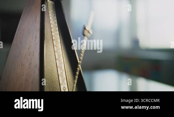 Close Up of Classic Wooden Metronome with Swinging Pendulum, Helping ...