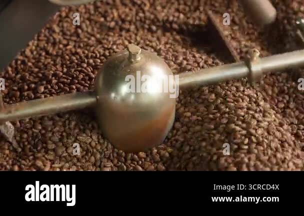 Roasted coffee beans mixing in industrial mixer machine roaster blend ...