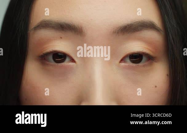 Cropped view Korean black female eyes looking at camera close up ...