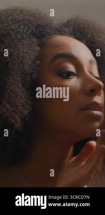 African American girl woman female looking at mirror reflection ...