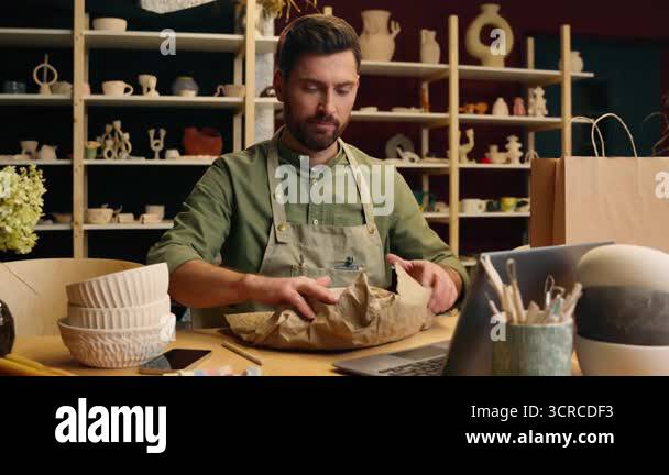 Careful Caucasian man guy businessman male small business owner potter ...