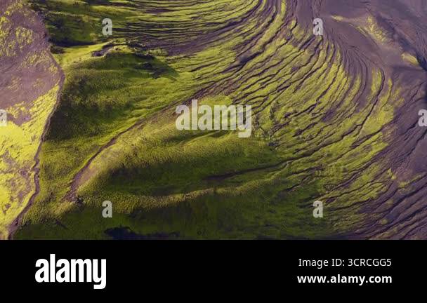 Aerial view of Iceland's volcanic terrain with green moss covered ...