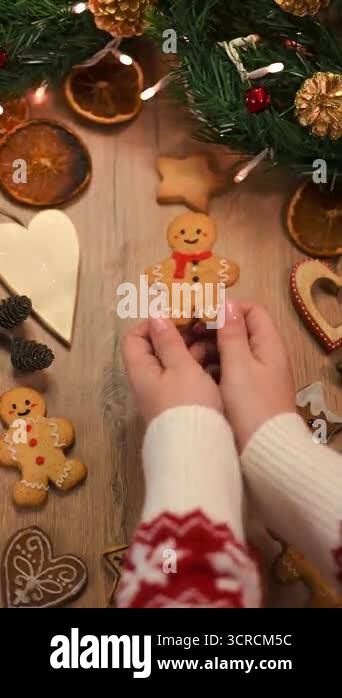 hands moving gingerbread man on cozy christmas table Stock Video ...