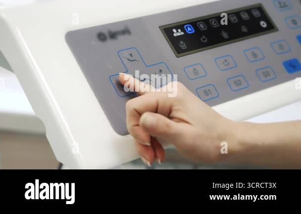 Close-up of doctors hands adjusting modern medical device. Modern ...