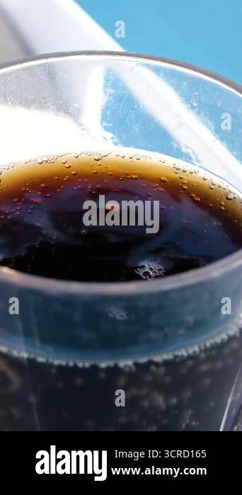Cola soft drink with ice cubes, Close up of soda fizzy drink in Cold ...