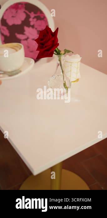 Single red rose in glass vase on elegant cafe table, romantic floral ...