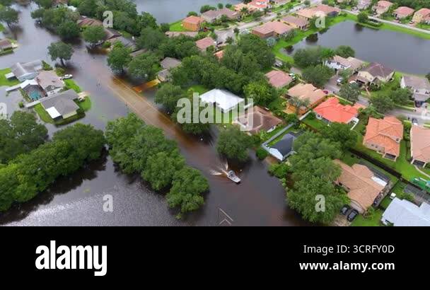 Aftermath of hurricane Debby flooding natural disaster. Boat floating ...