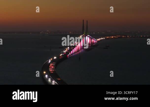 Highway road with driving traffic cars at night on Sunshine Skyway ...