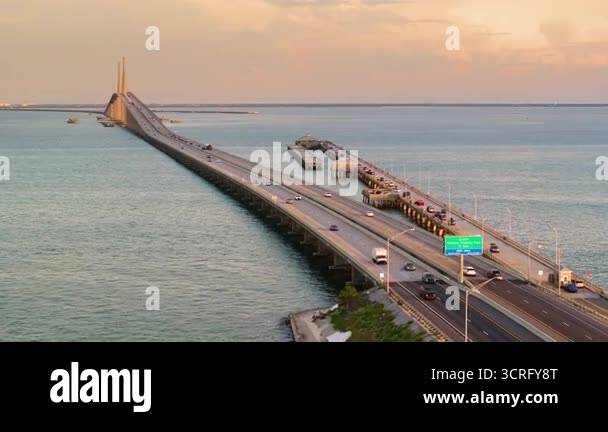 Cars driving on Sunshine Skyway Bridge over Tampa Bay in Florida at ...