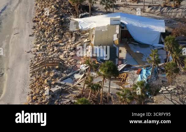 Destroyed houses on ocean coast. Hurricane Milton consequences in ...