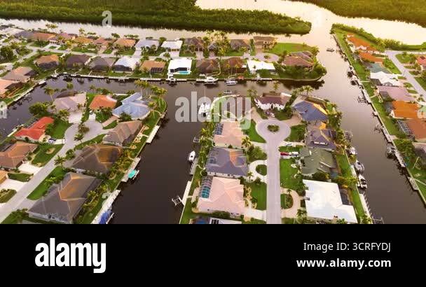 Sunset aerial panorama of Florida Gulf waterfront. Wealthy neighborhood ...
