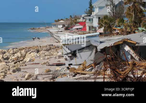 Storm surge severe damage to residential houses on ocean shore after ...