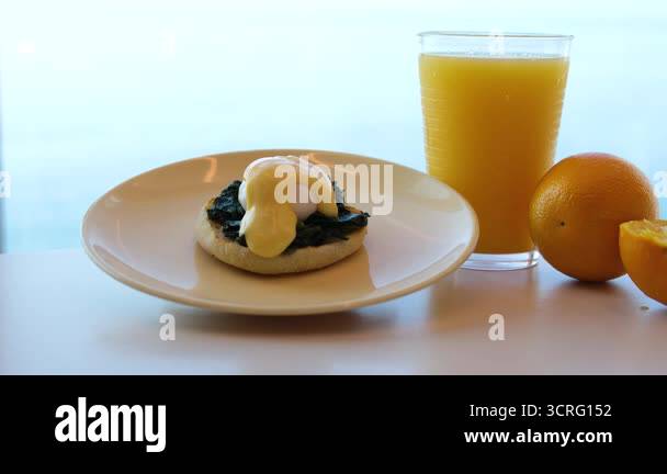 Healthy breakfast with fresh fruits, eggs, orange juice, and whole ...