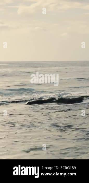 Sea waves crashing on beach and splashing. Stormy rainy weather at sea ...
